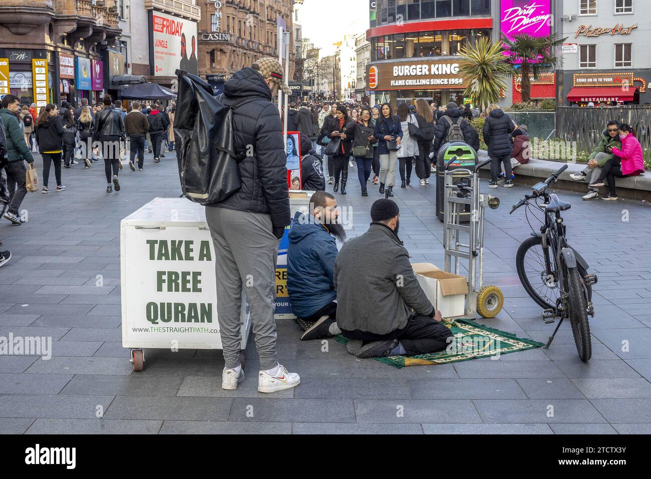 Muslims praying and giving free qurans on Leicester square, London, U.K ...