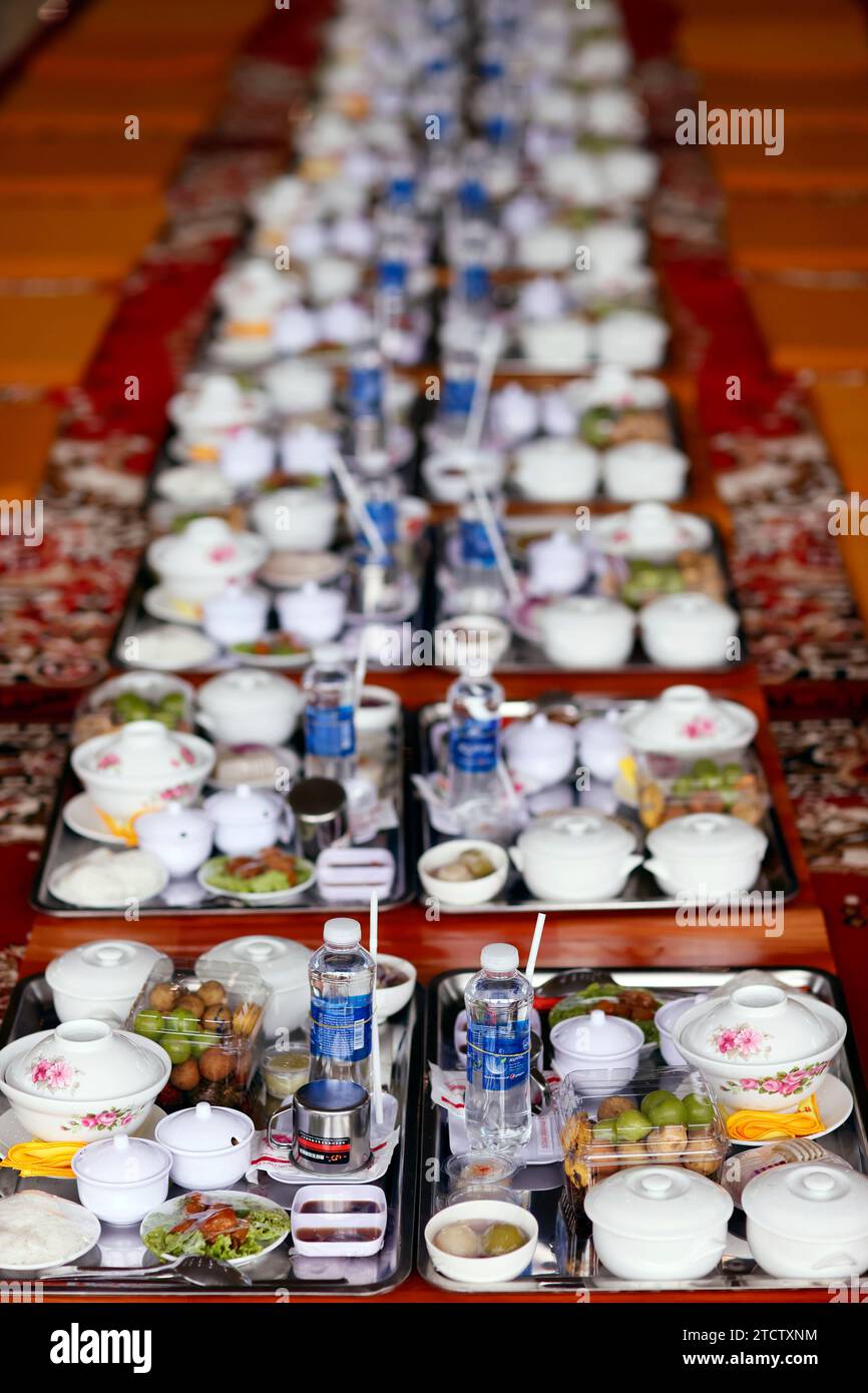 Phuoc Hue buddhist pagoda. Vegetarian meal for monks set in main hall ...
