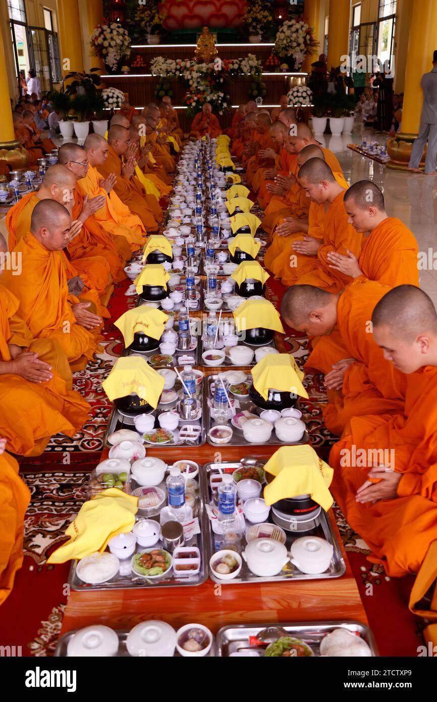 Phuoc Hue buddhist pagoda. Monks at buddhist ceremony in the main hall ...