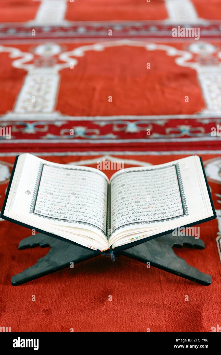Mubarak mosque. Open Quran in arabic on wood stand. Symbol of Islam. Vietnam Stock Photo - Alamy