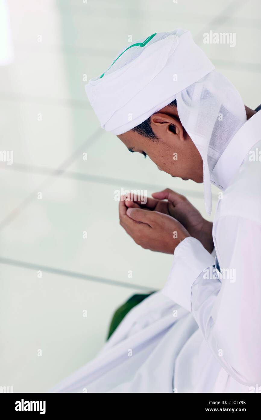 Jamiul Azhar mosque. The friday prayer (salat). Muslim man praying in ...