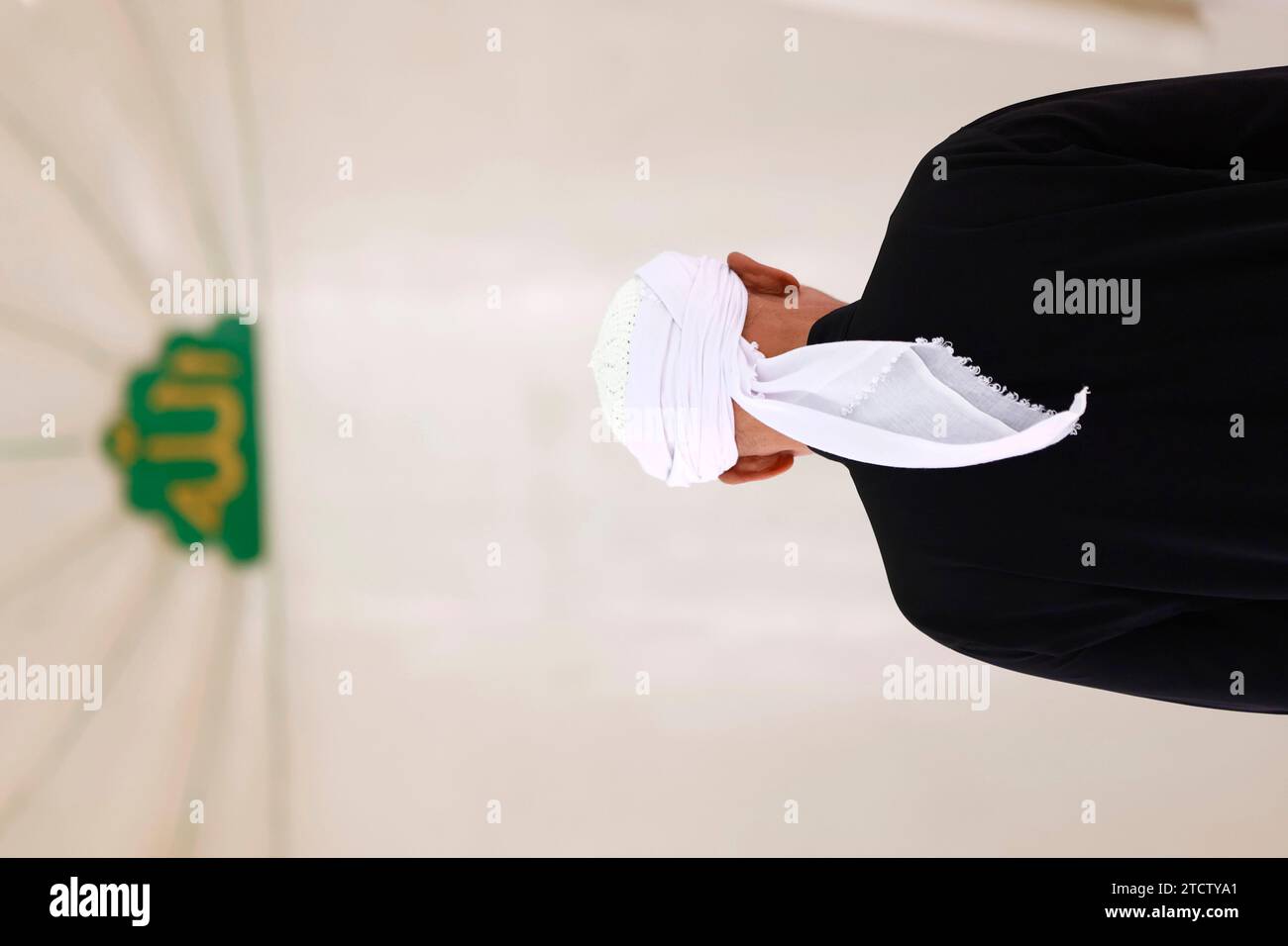 Back view. Jamiul Azhar mosque. The friday prayer (salat). Muslim man ...