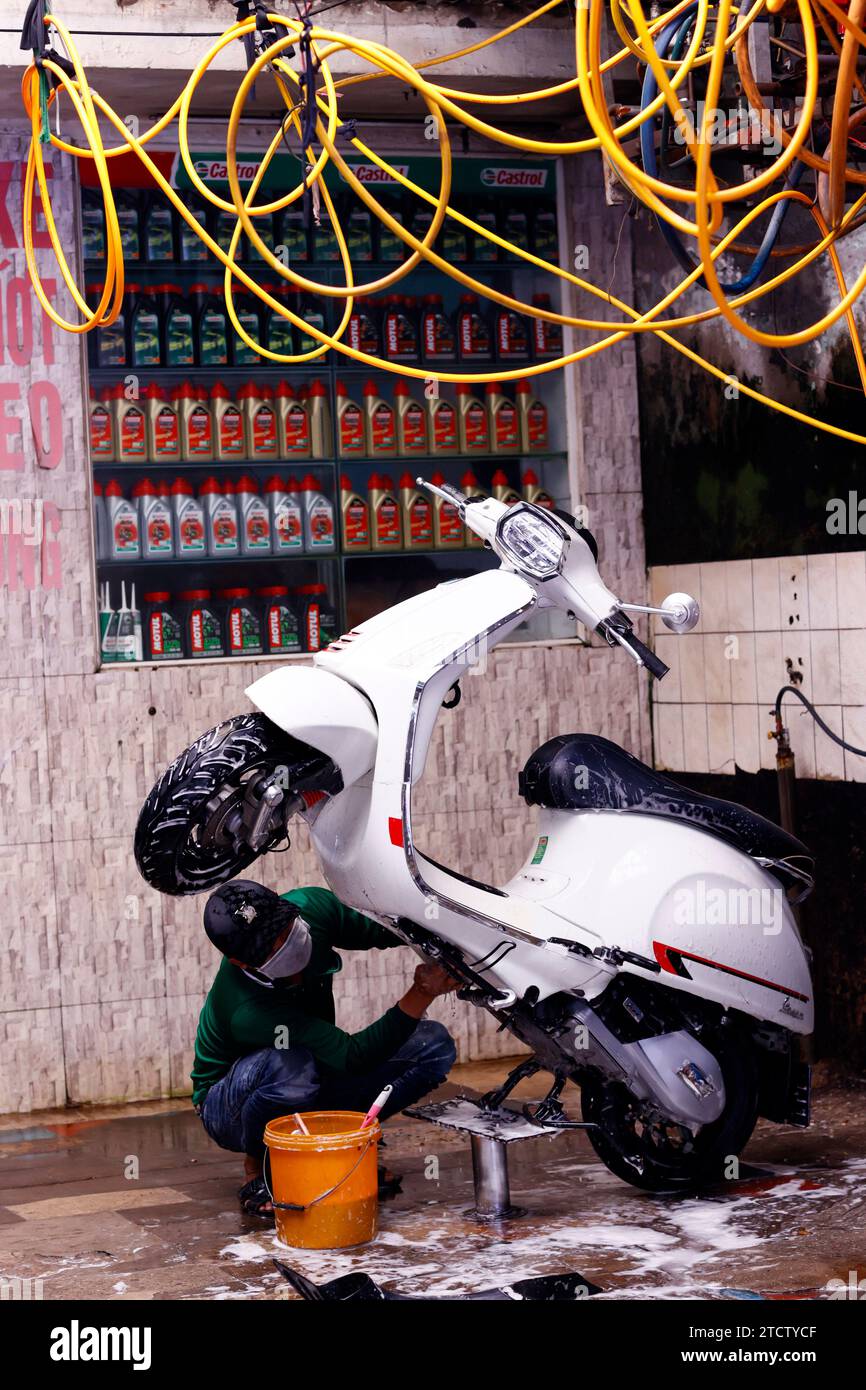 Washing scooter vietnam hi-res stock photography and images - Alamy