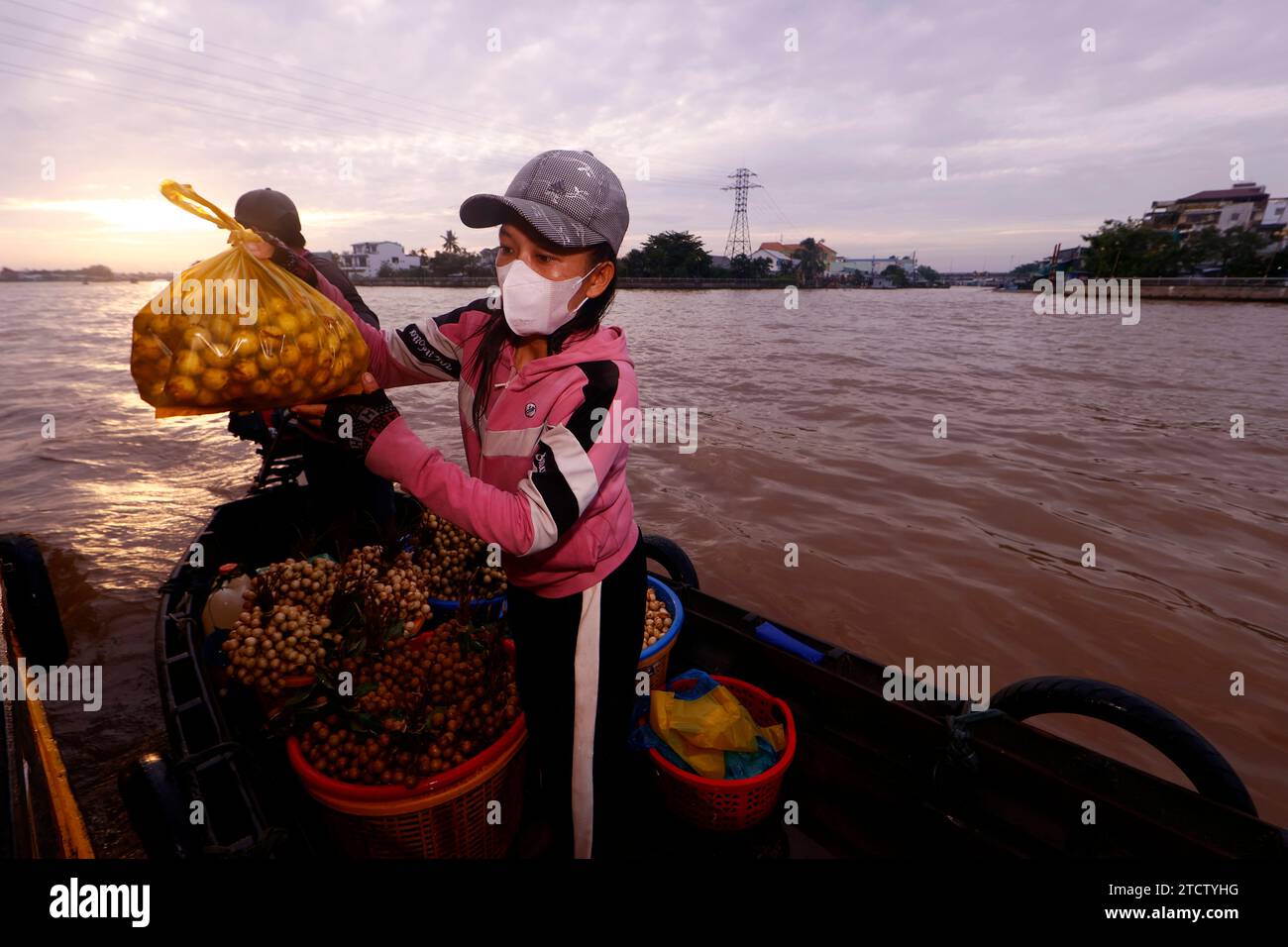 Can Tho floating market in Mekong Delta. Woman selling fruits Stock ...