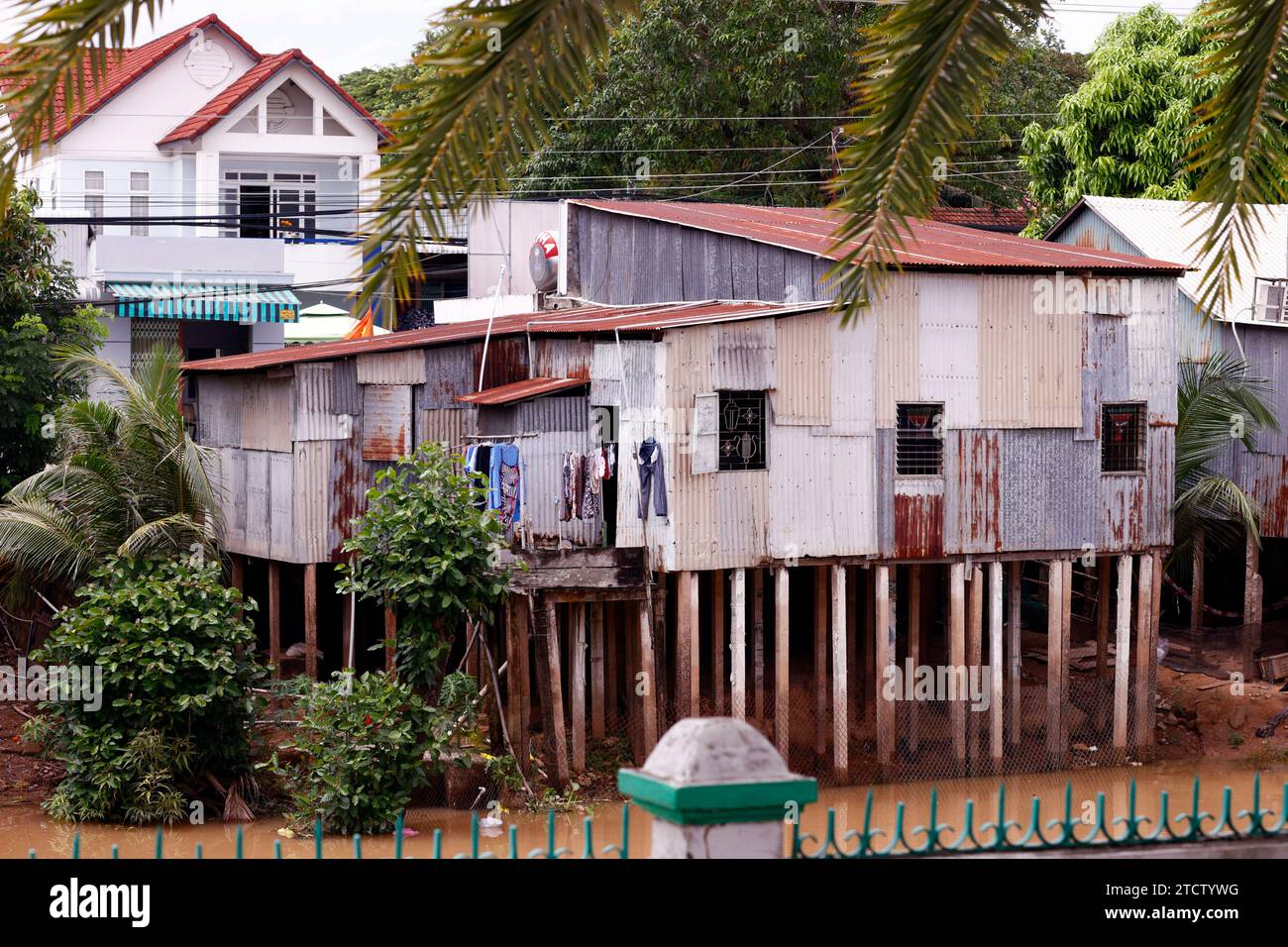 Poor houses on stilts. Mekong Delta Stock Photo - Alamy