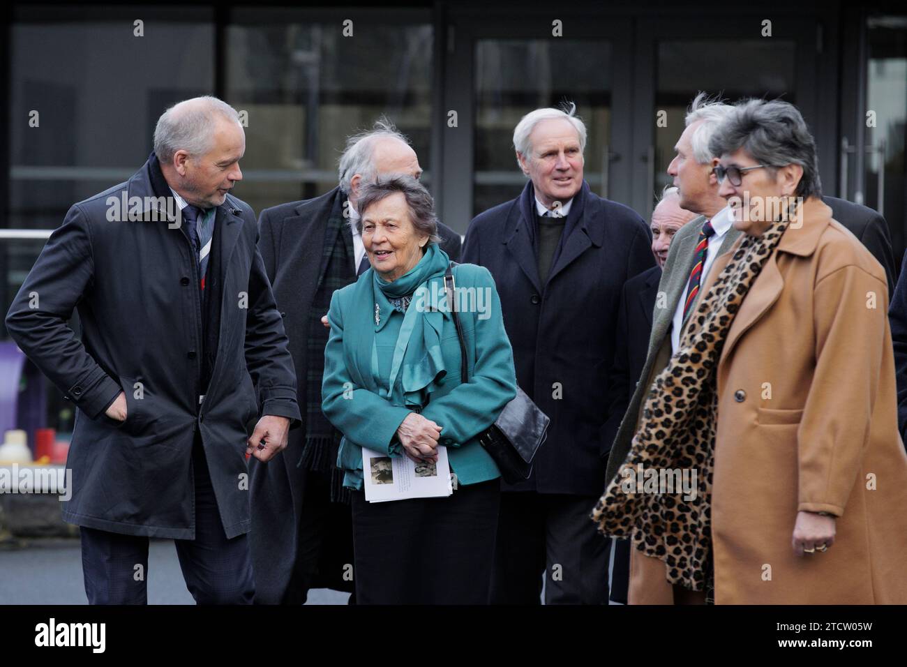 Trevor Ringland (left) speaking with a mourner following the funeral of ...