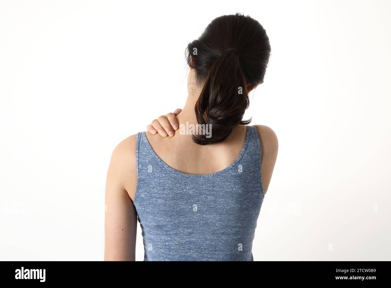 Back view of woman holding sore back neck and shoulder and waist Stock ...