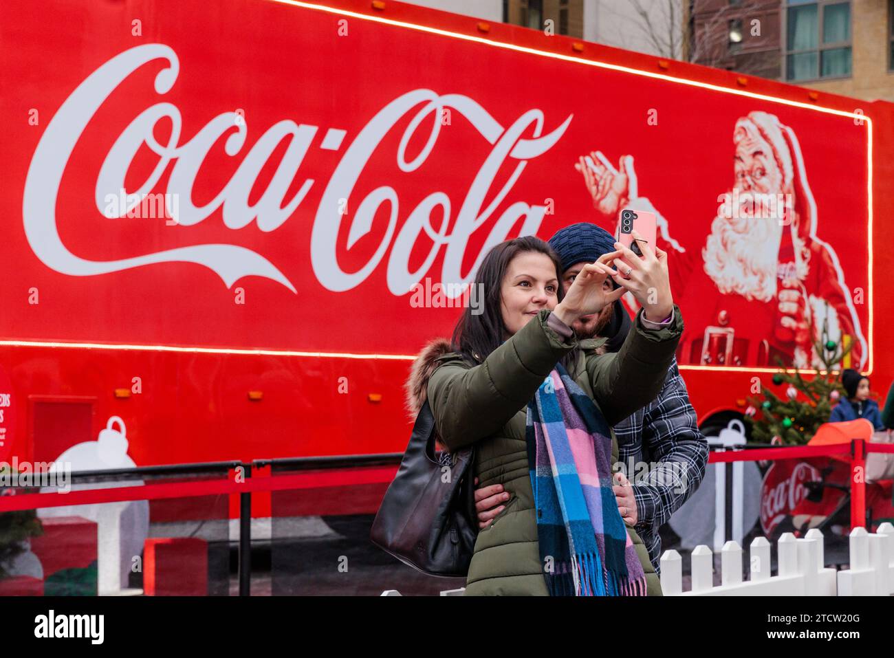 Wembley Park, London, UK. 14th December 2023. Visitors take selfies with the iconic Coca Cola ...