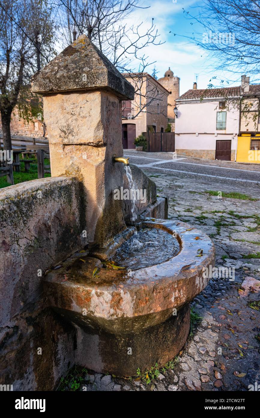 Water fountain made of ancient stone in the medieval village of ...