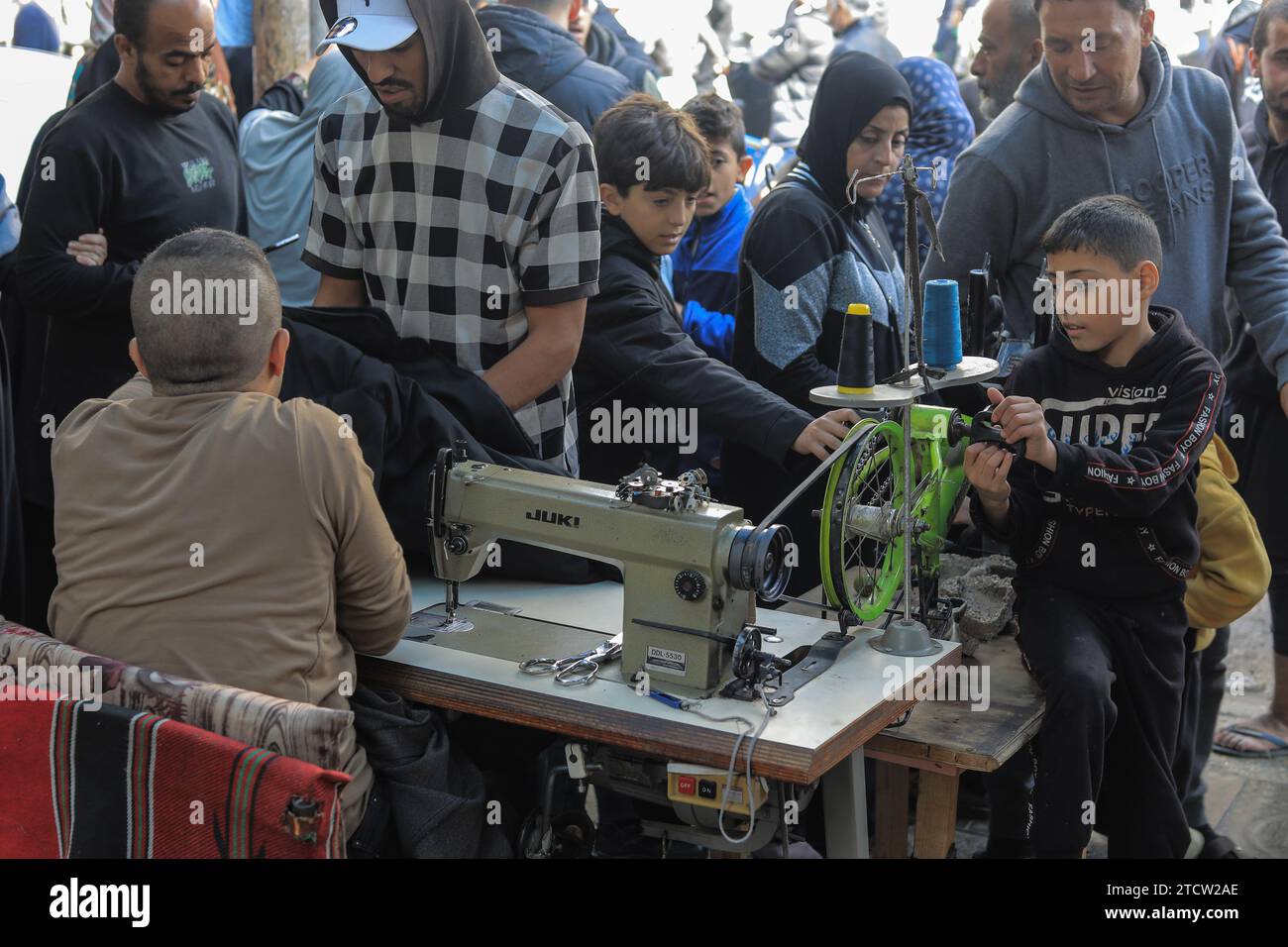 Rafah, Palestinian Territories. 14th Dec, 2023. Palestinian tailor ...