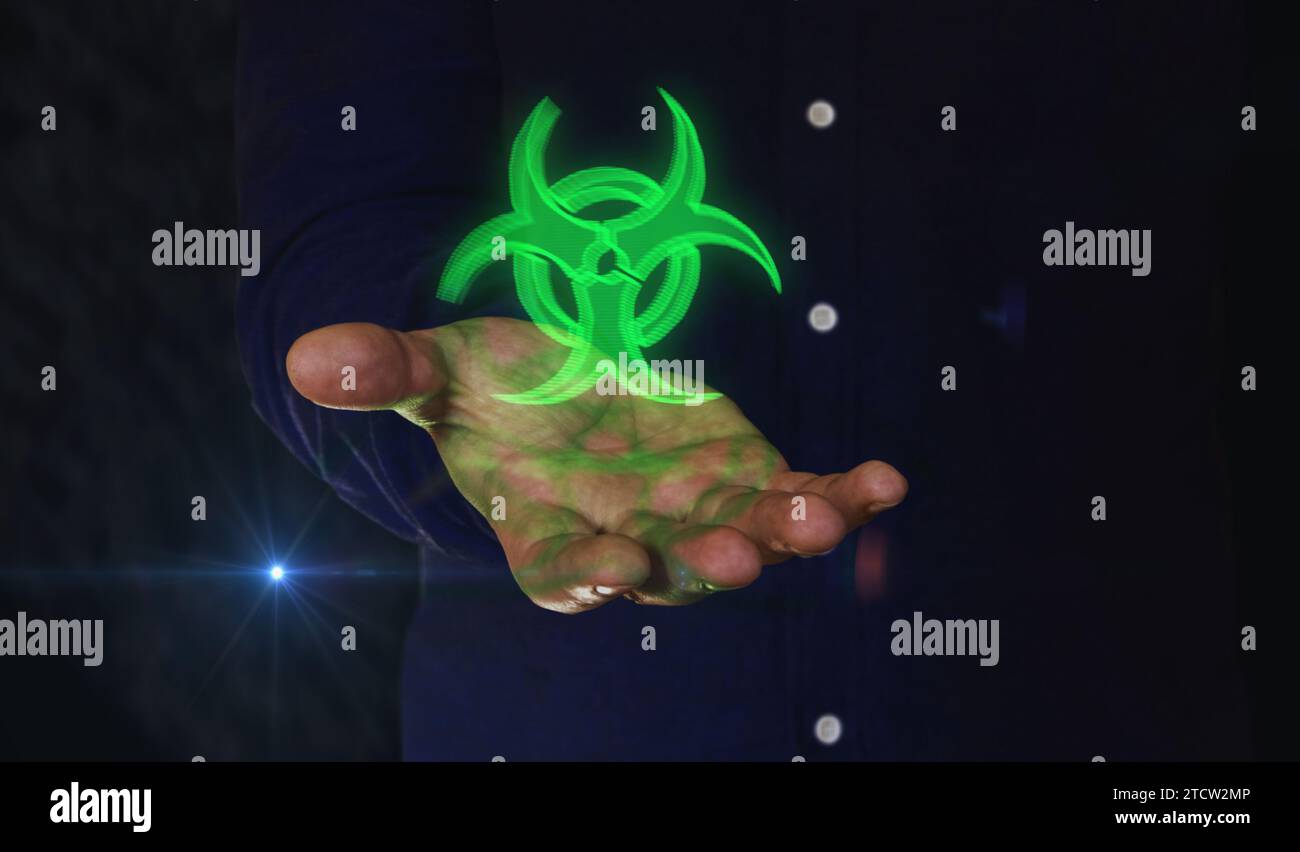 Biohazard danger alert and virus warning 3d symbol over man hand. Cyber ...