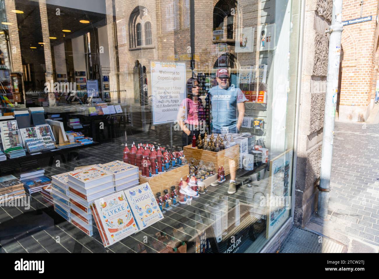 Showcase of a souvenirs shop with books and souvenirs and reflection of ...