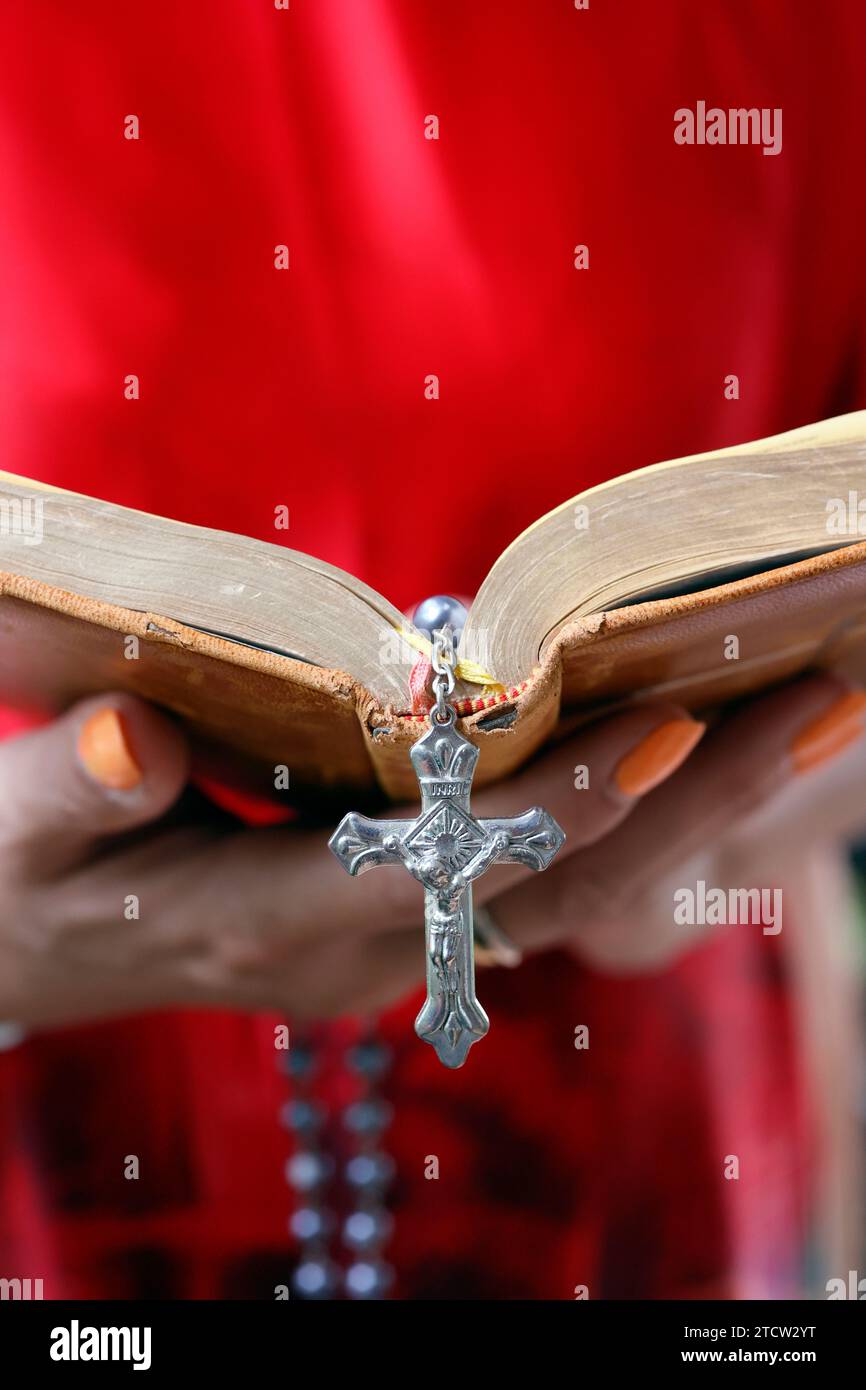 Woman reading the Holy Bible. Rosary with Jesus on the cross Stock ...