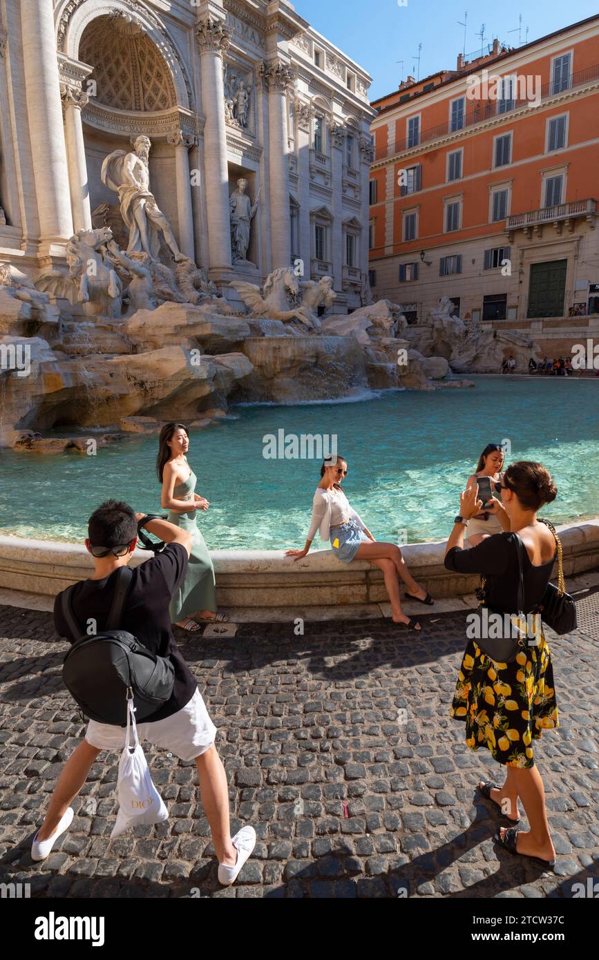 Tourists pose for pictures at the Trevi Fountain, Rome, Italy Stock ...
