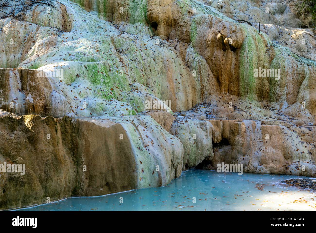 A close-up view of hot springs pool and calcium carbonate deposit in ...