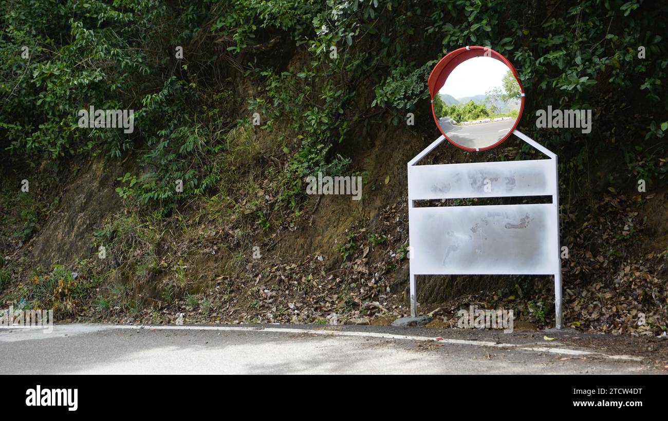 Outdoor traffic convex mirror in the hairpin bends and uphill road ...