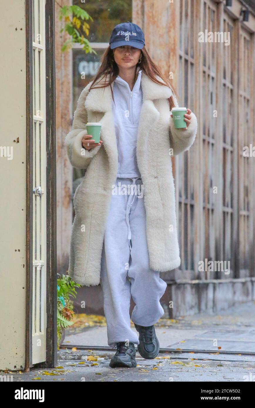 Emily Ratajkowski wears a white fur coat and sweatpants while out on a ...