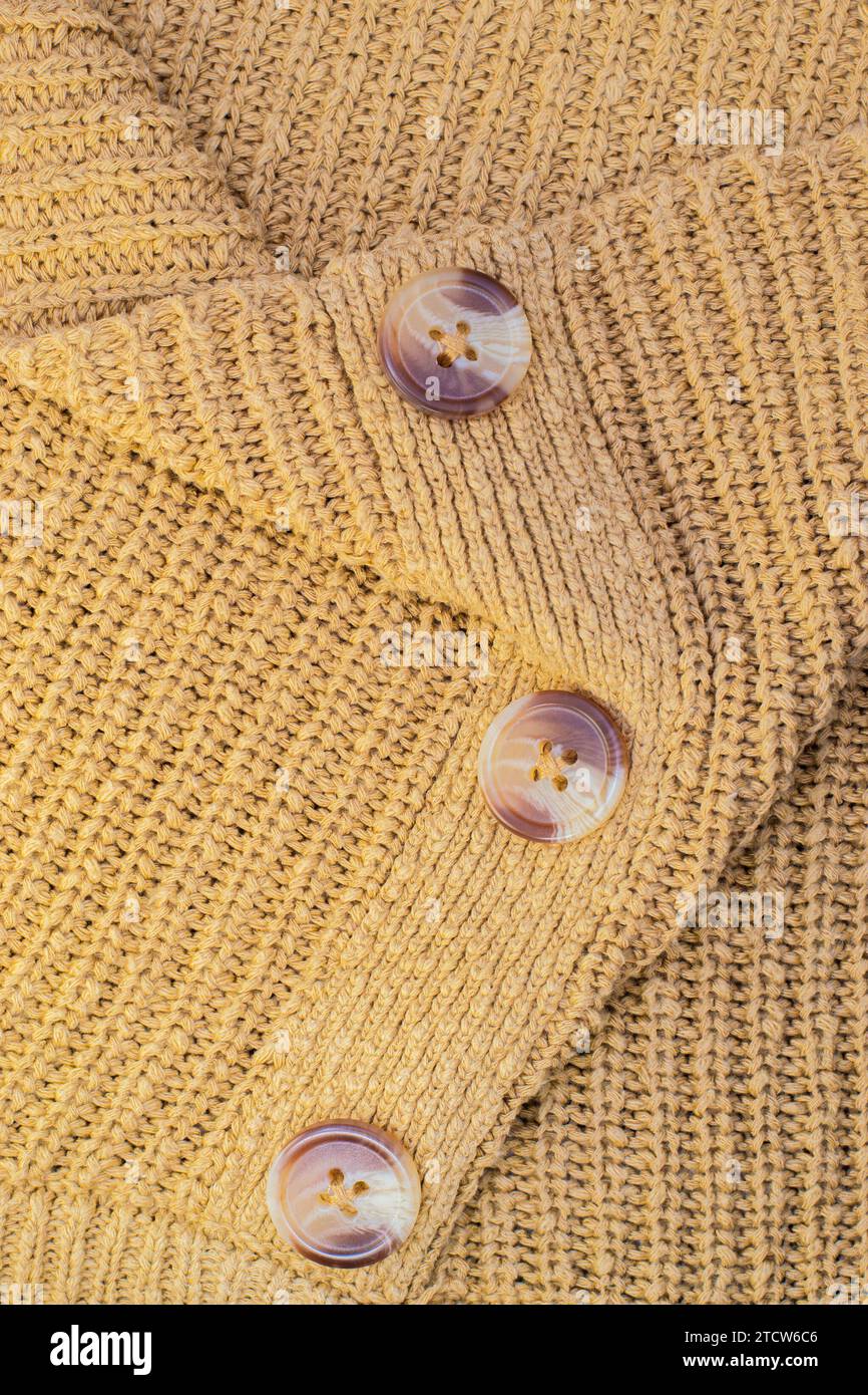 Detail of the buttons and the texture of a sweater fabric Stock Photo ...
