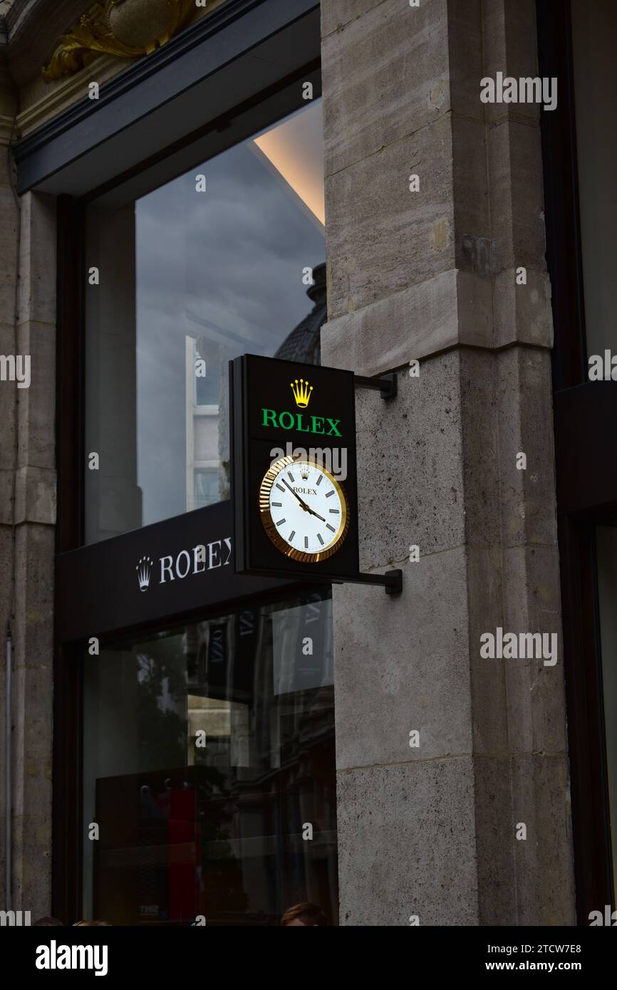 Rolex working clock sign telling the time and Rolex logo outside an ...