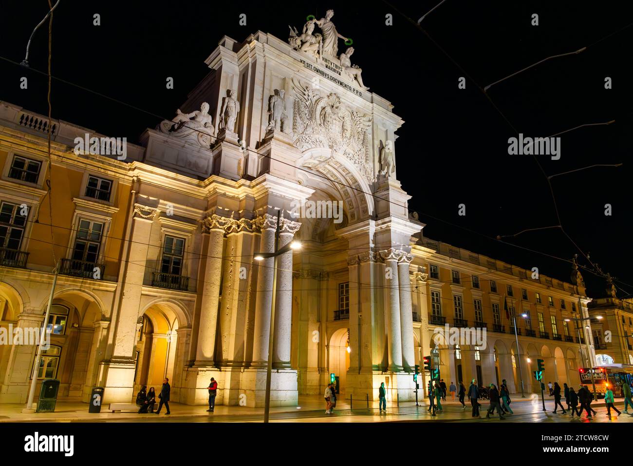 Evening view of an illuminated Arco da Rua Augusta Arch at the Praça do ...