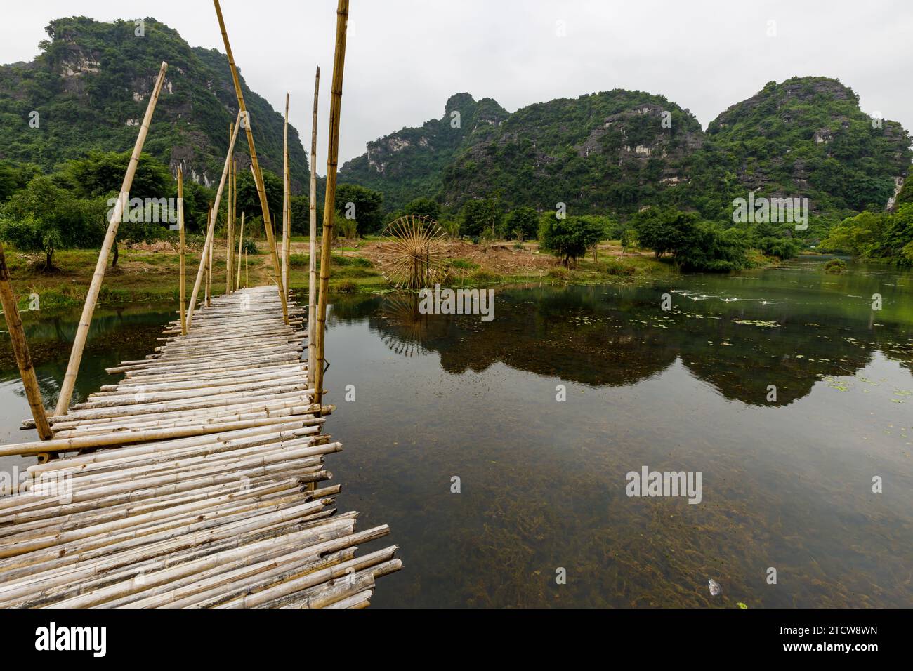 The Landscape with bamboo bridge at Tam Coc in Vietnam Stock Photo - Alamy