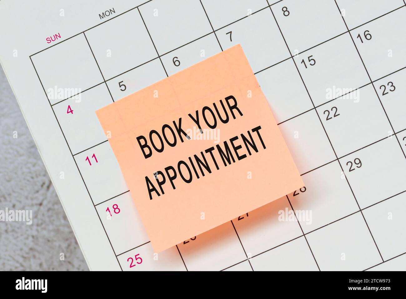 Book your appointment text on sticky note and stuck to a calendar ...