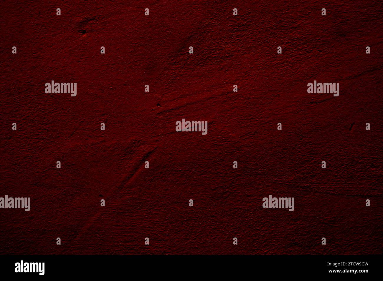 Crimson red colored abstract wall background with textures of different ...