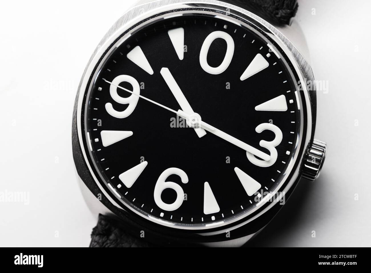 Automatic mechanical wrist watch with black clock face and bold white ...