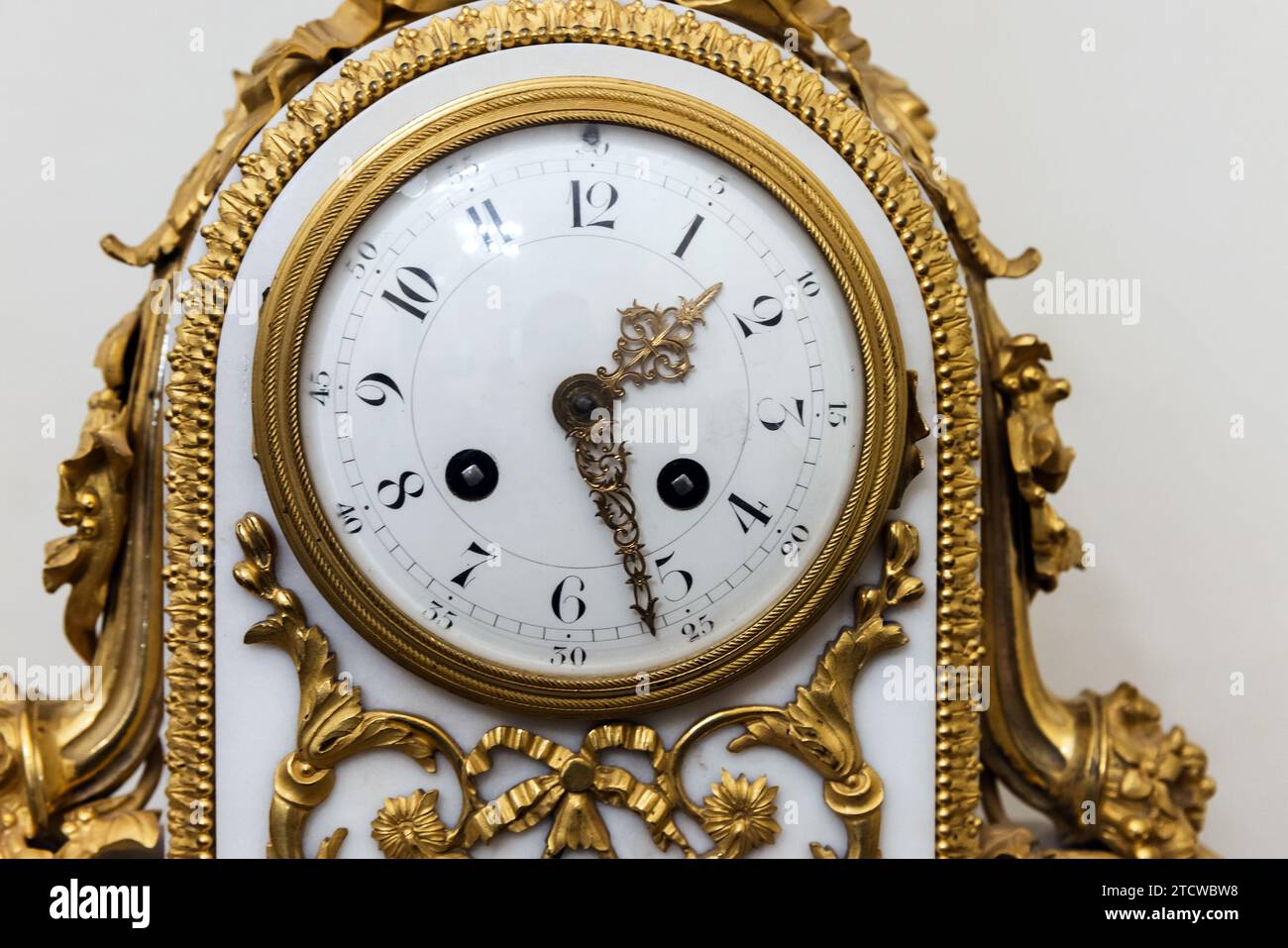 Vintage chiming mantel clock, close up photo, front view. White clock ...