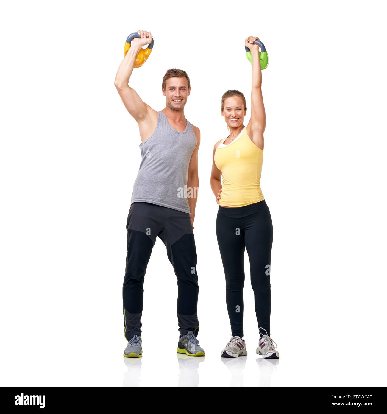Studio portrait, kettlebell exercise and happy people celebrate muscle ...