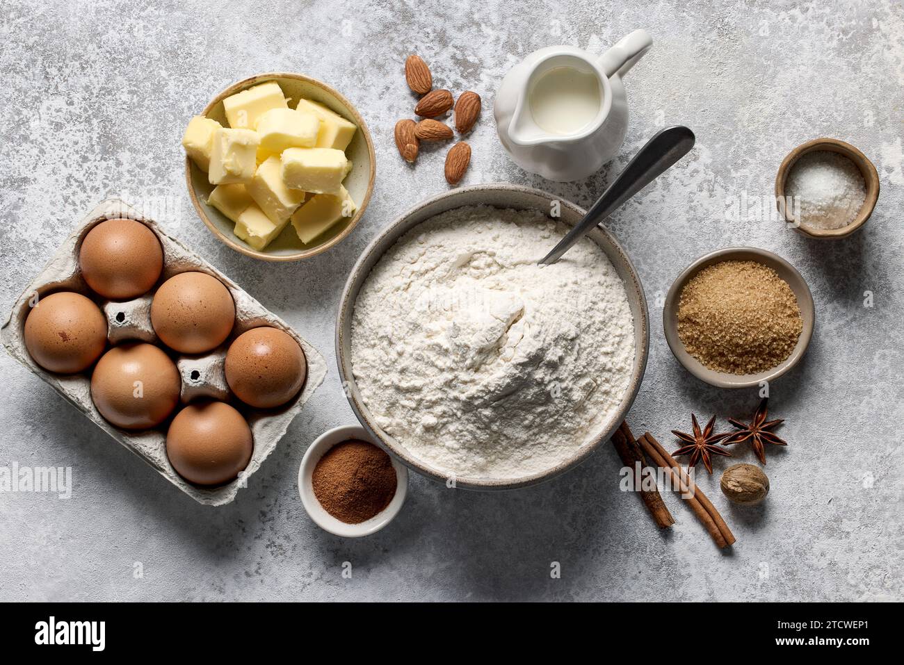 various baking ingredients on light grey painted kitchen table ...