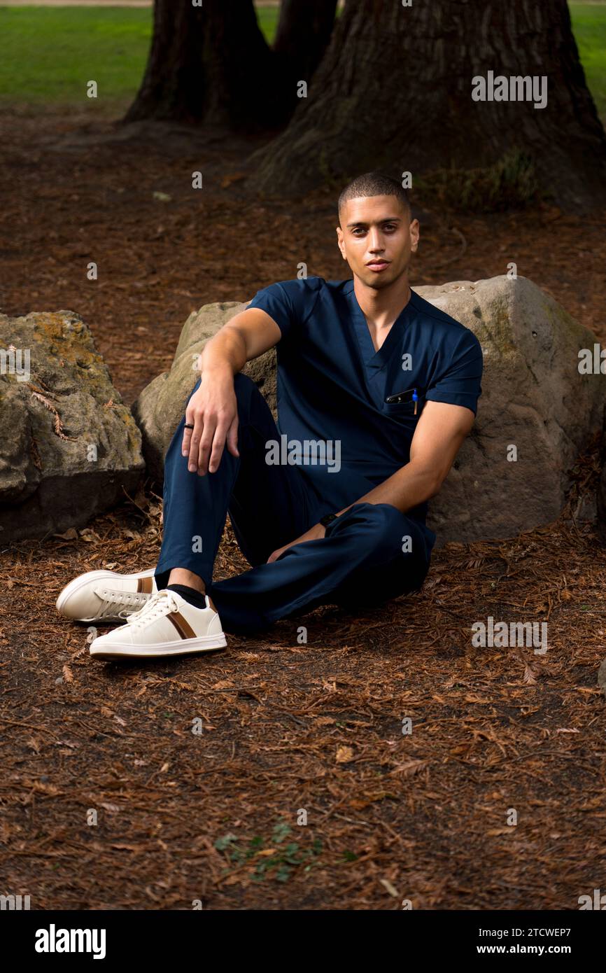 Medical Doctor Wearing Scrubs in a Park Late Afternoon Moody Stock ...