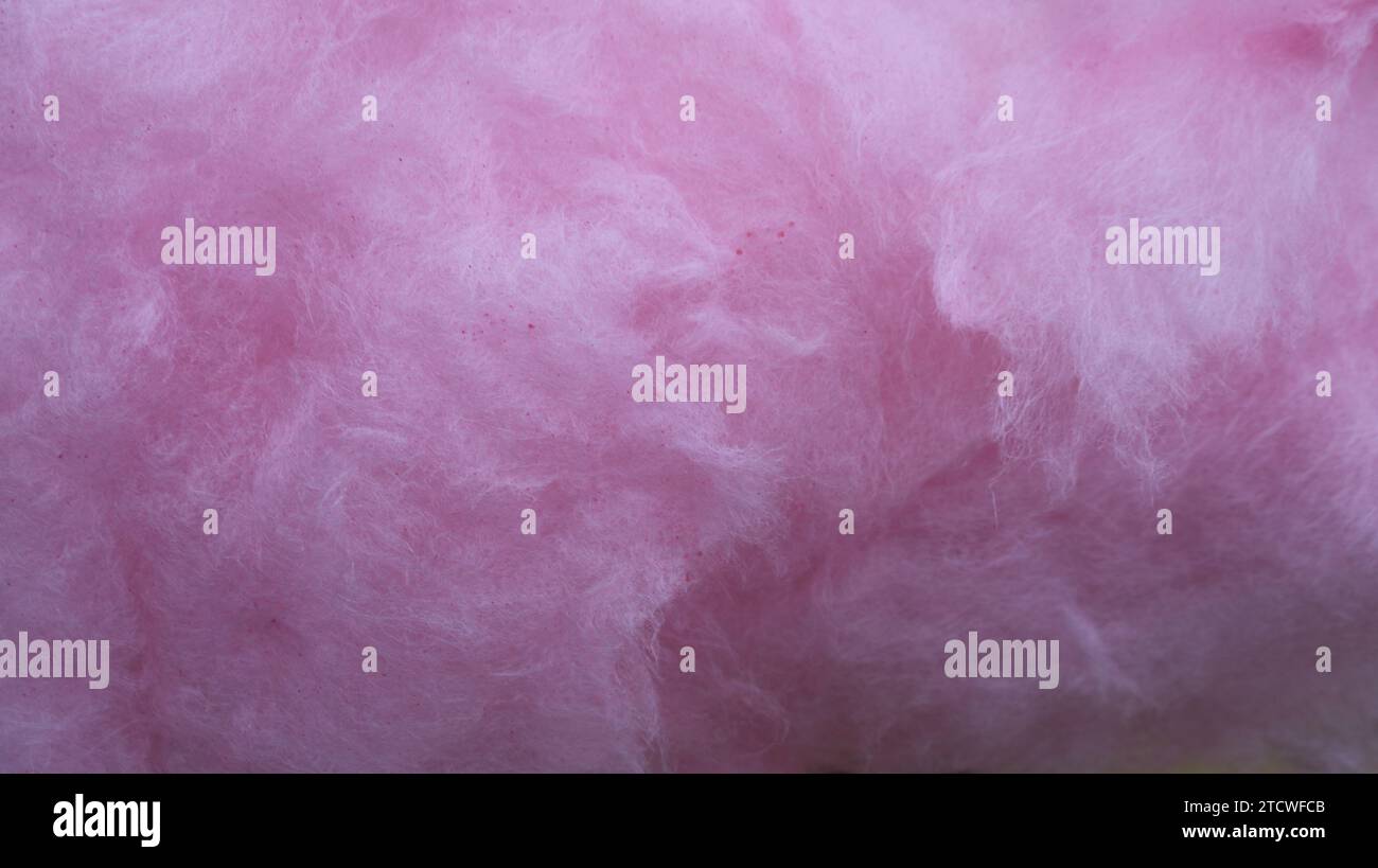 pink background of fluffy weightless material close-up, fluffy texture ...