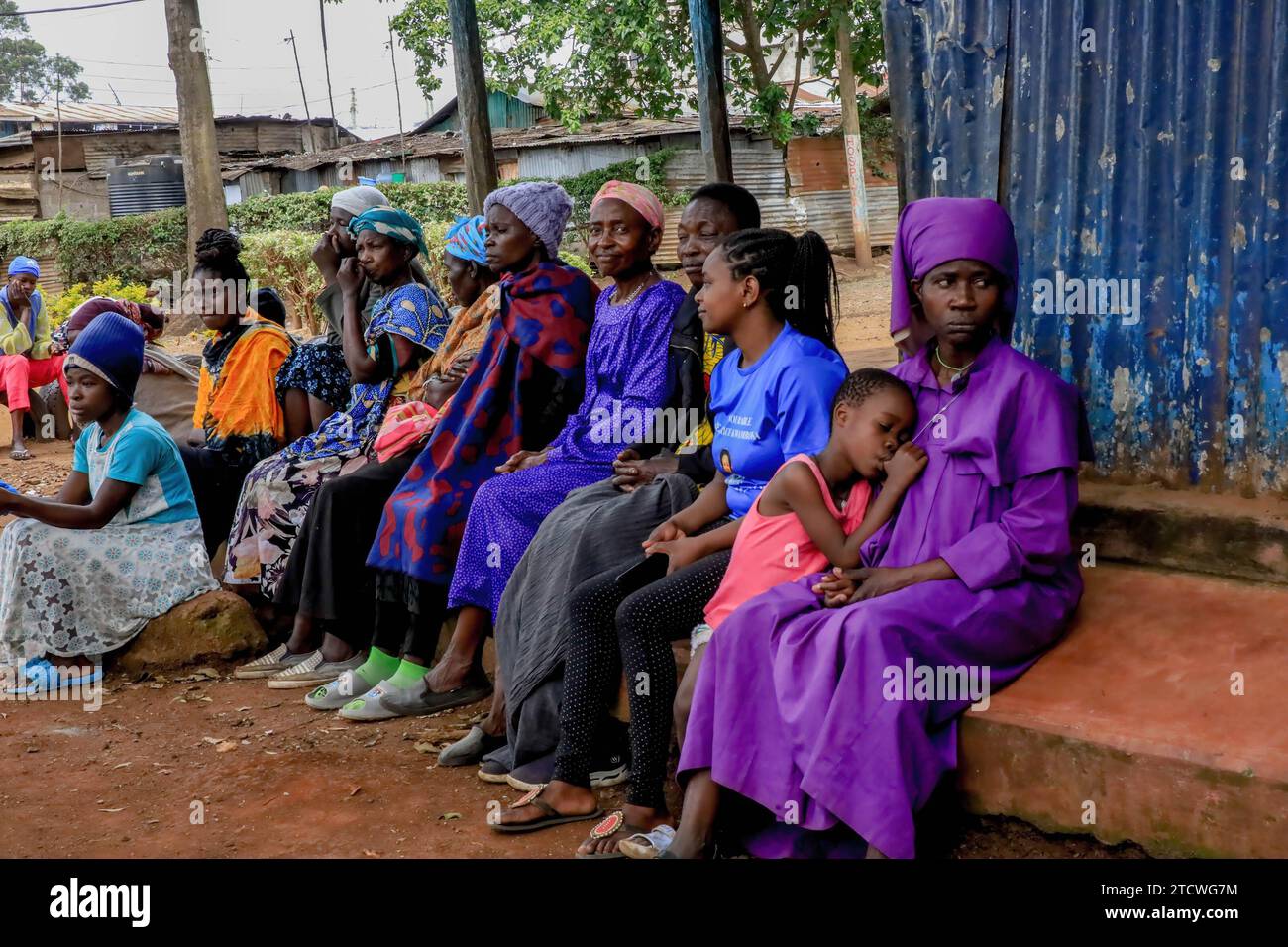 Resident of Kibera wait for Christmas food packages to be distributed ...