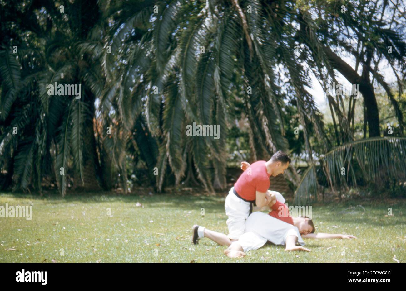 1950'S: Two men practice a karate flipping move circa 1950's. (Photo by ...