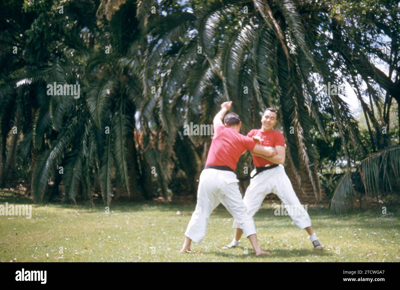 1950'S: Two men practice a karate flipping move circa 1950's. (Photo by ...