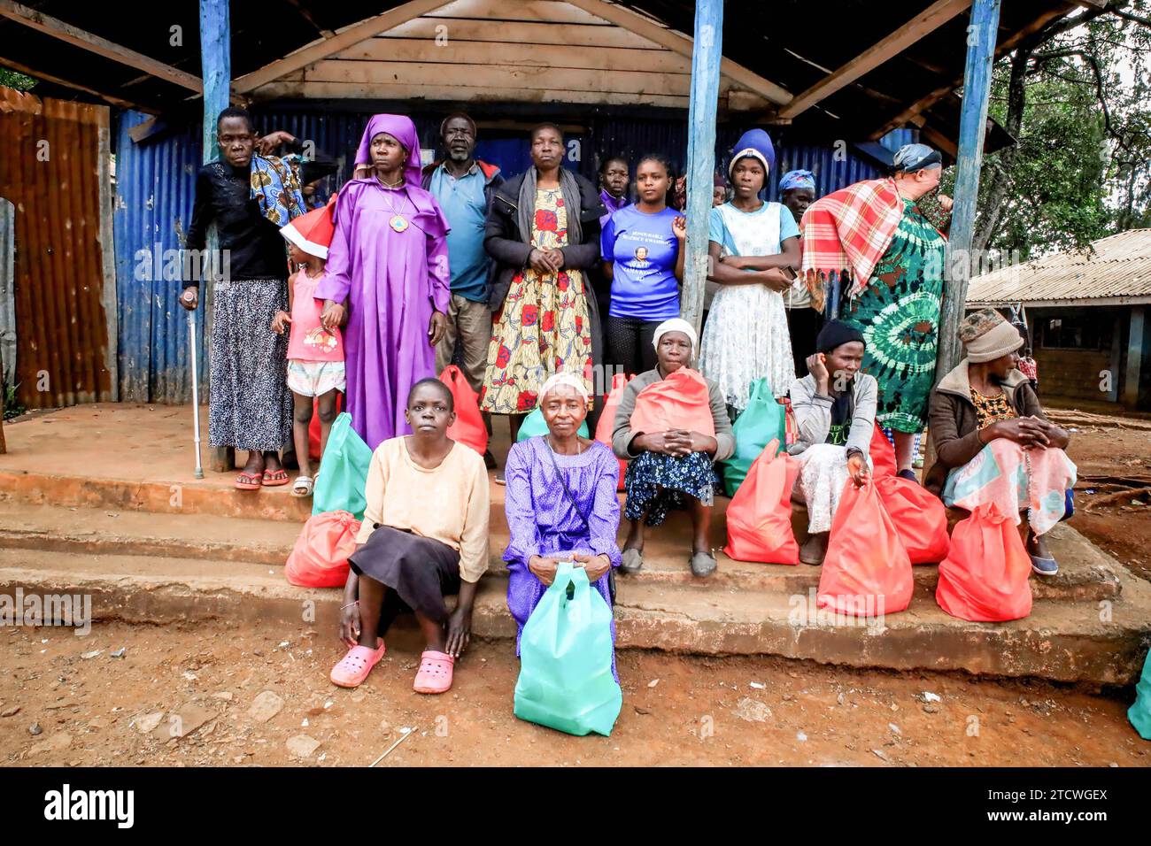 Nairobi, Kenya. 12th Dec, 2023. Kibera residents pose for a group photo ...