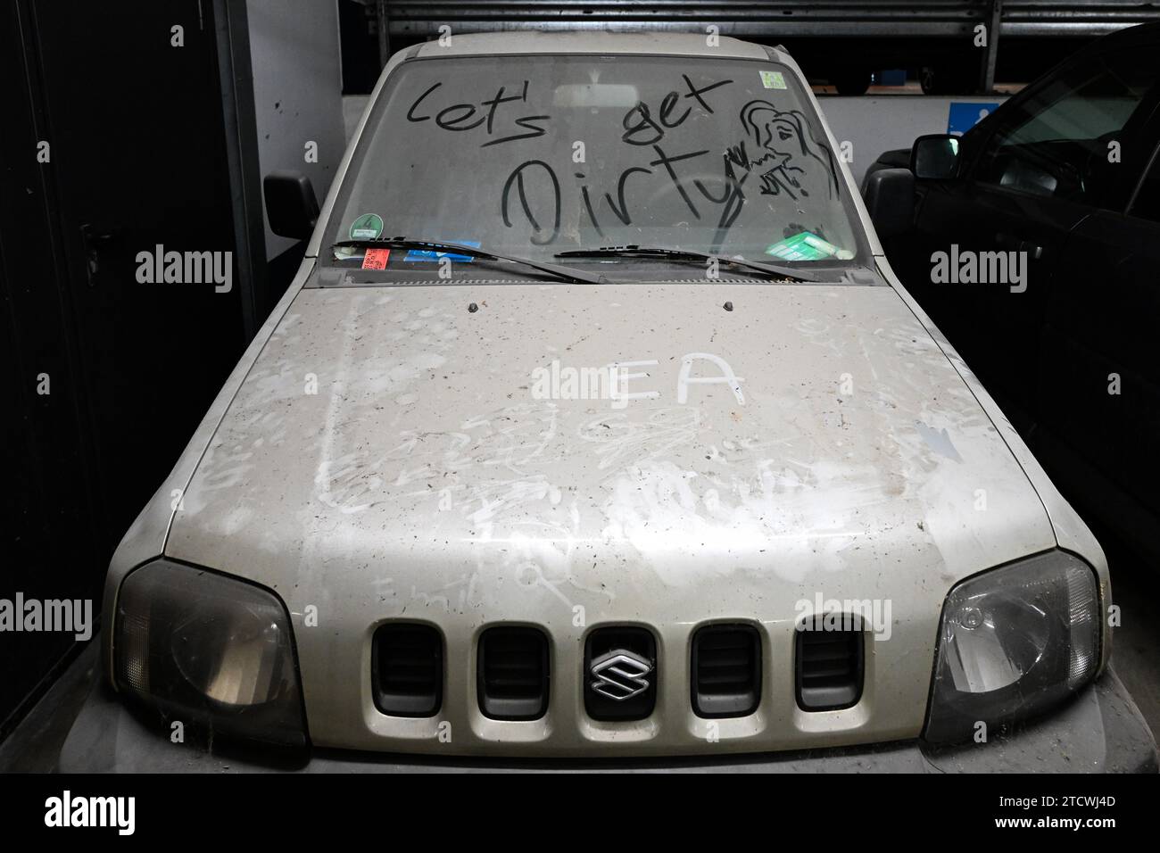 Potsdam, Germany. 14th Dec, 2023. A very dirty "Suzuki" car without ...