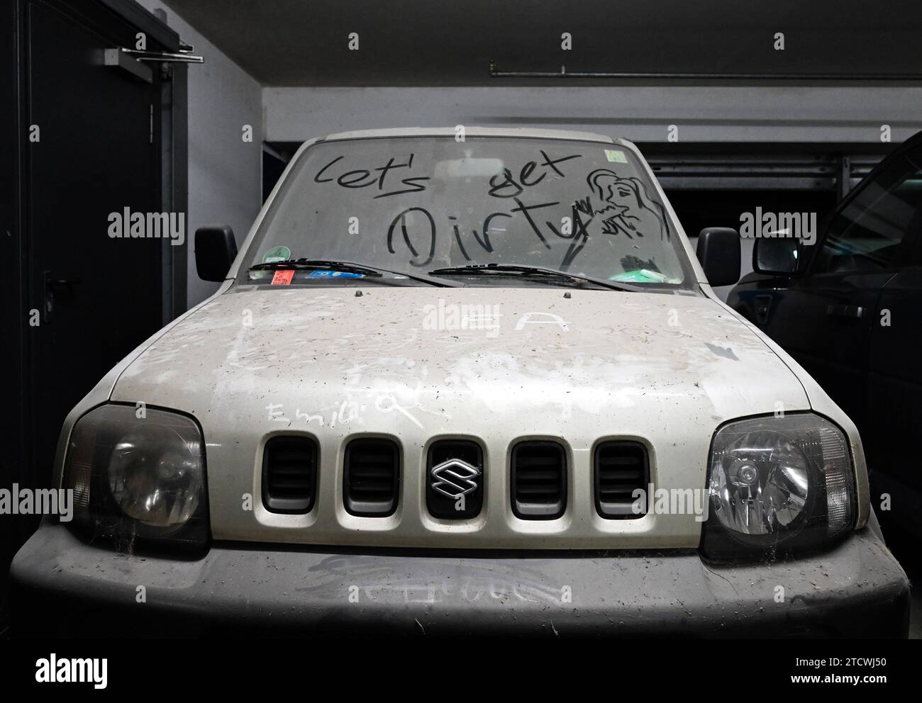 Potsdam, Germany. 14th Dec, 2023. A very dirty "Suzuki" car without ...