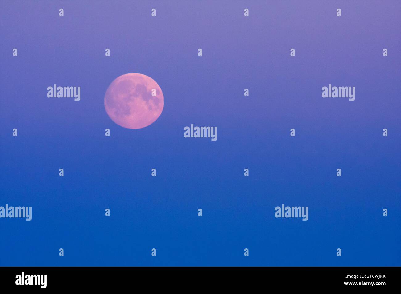Full moon, a lunar phase, just above the sea level. Late evening up ...