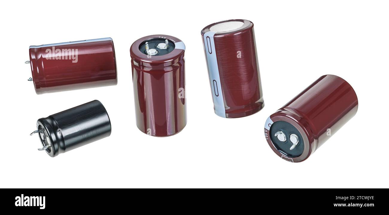 Set of various electrolytic capacitors isolated on a white background. Close-up a group of ...