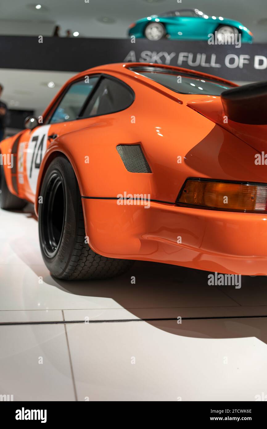 Photo of the car from the back and bottom. Orange Porsche sports car ...