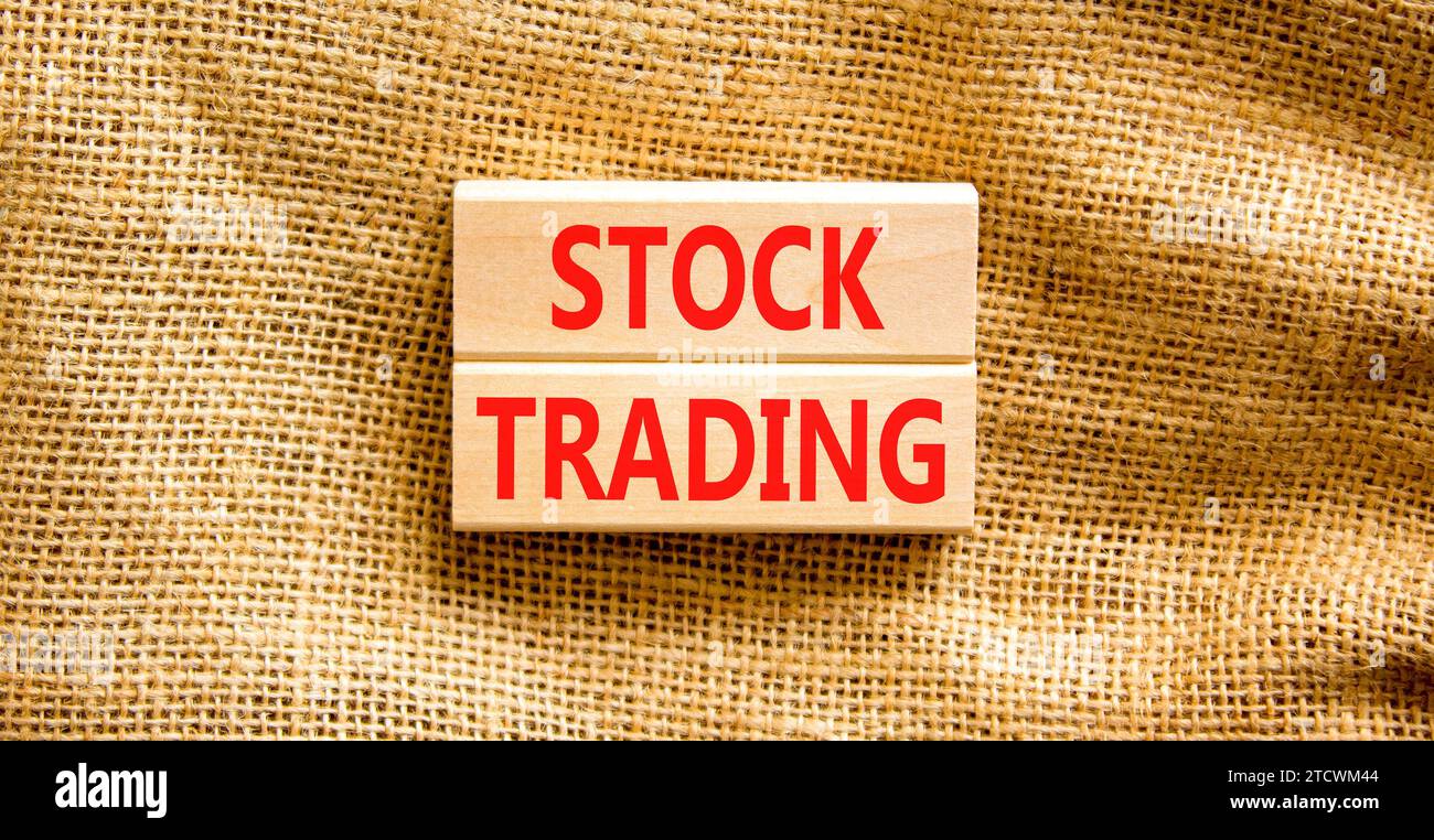 Stock trading symbol. Concept words Stock trading on beautiful wooden ...