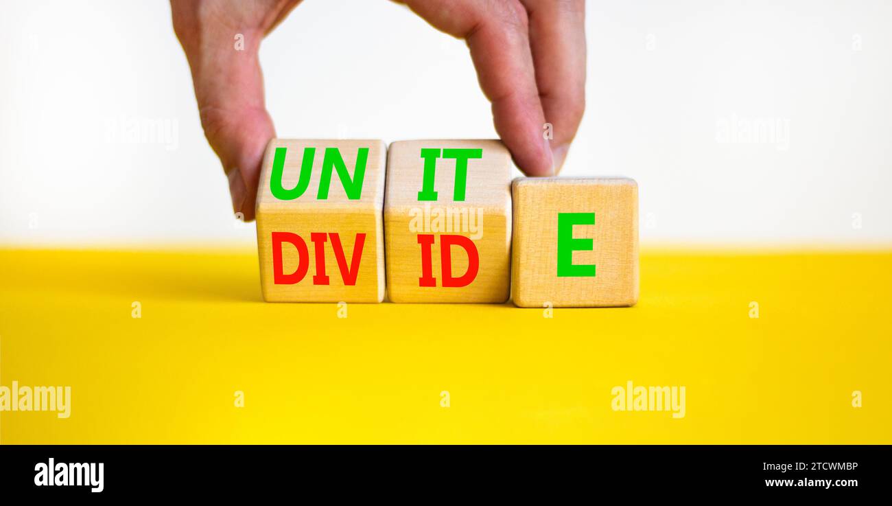 Unite or divide symbol. Concept word Unite or Divide on wooden cubes ...