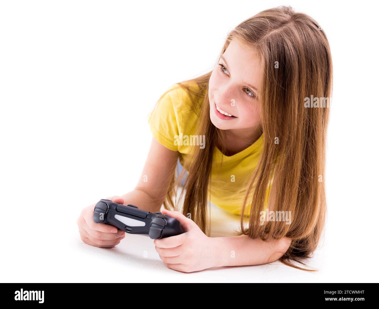 Concentrated and focused on winning a computer game girl, lying with a ...