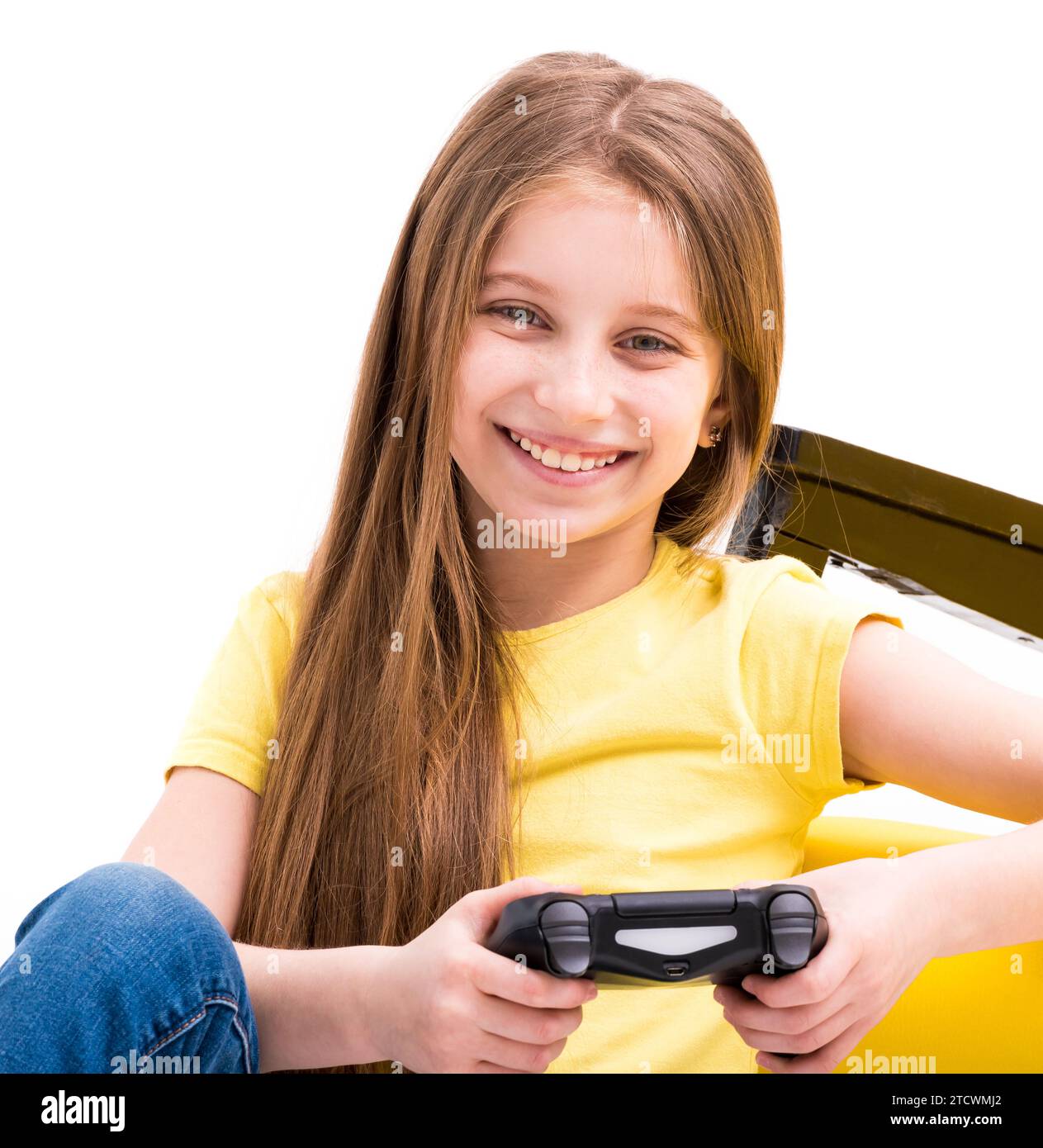 Smiling girl playing a computer game on a playing console, black ...