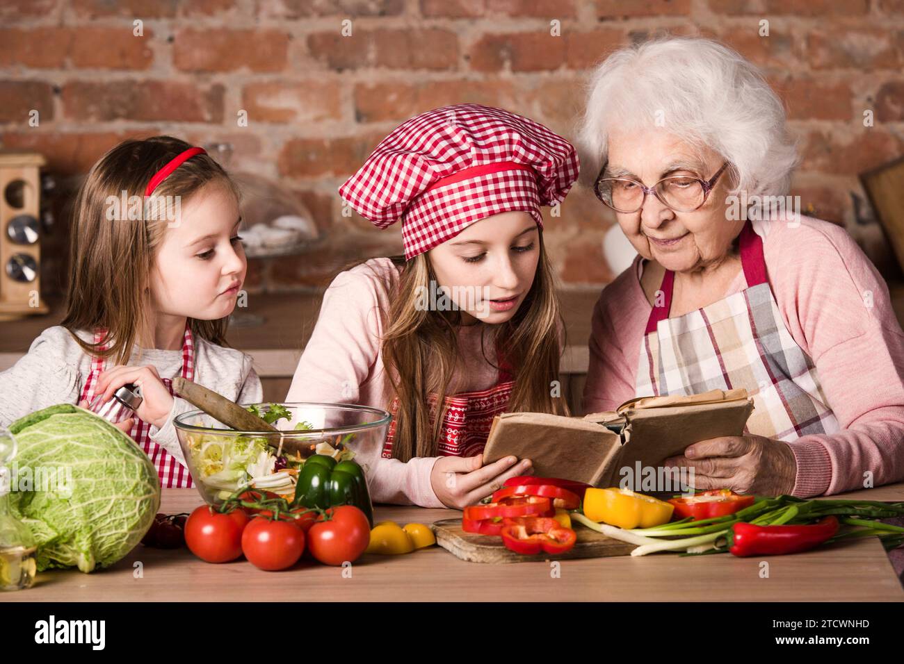 Child and parent and cooking and book hi-res stock photography and ...