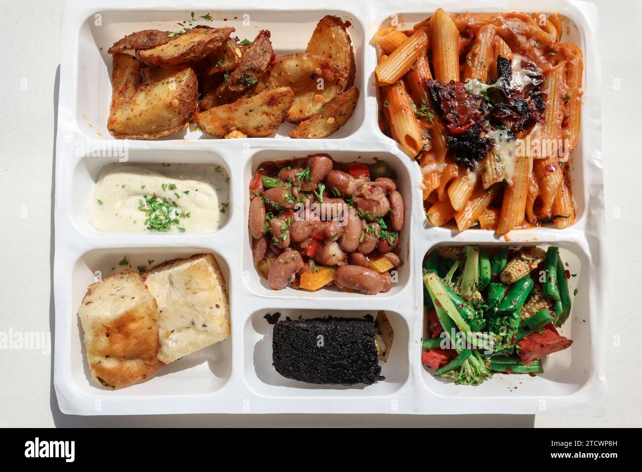 Continental lunch box consists of Potato wedges, Pasta, Brocolli salad ...
