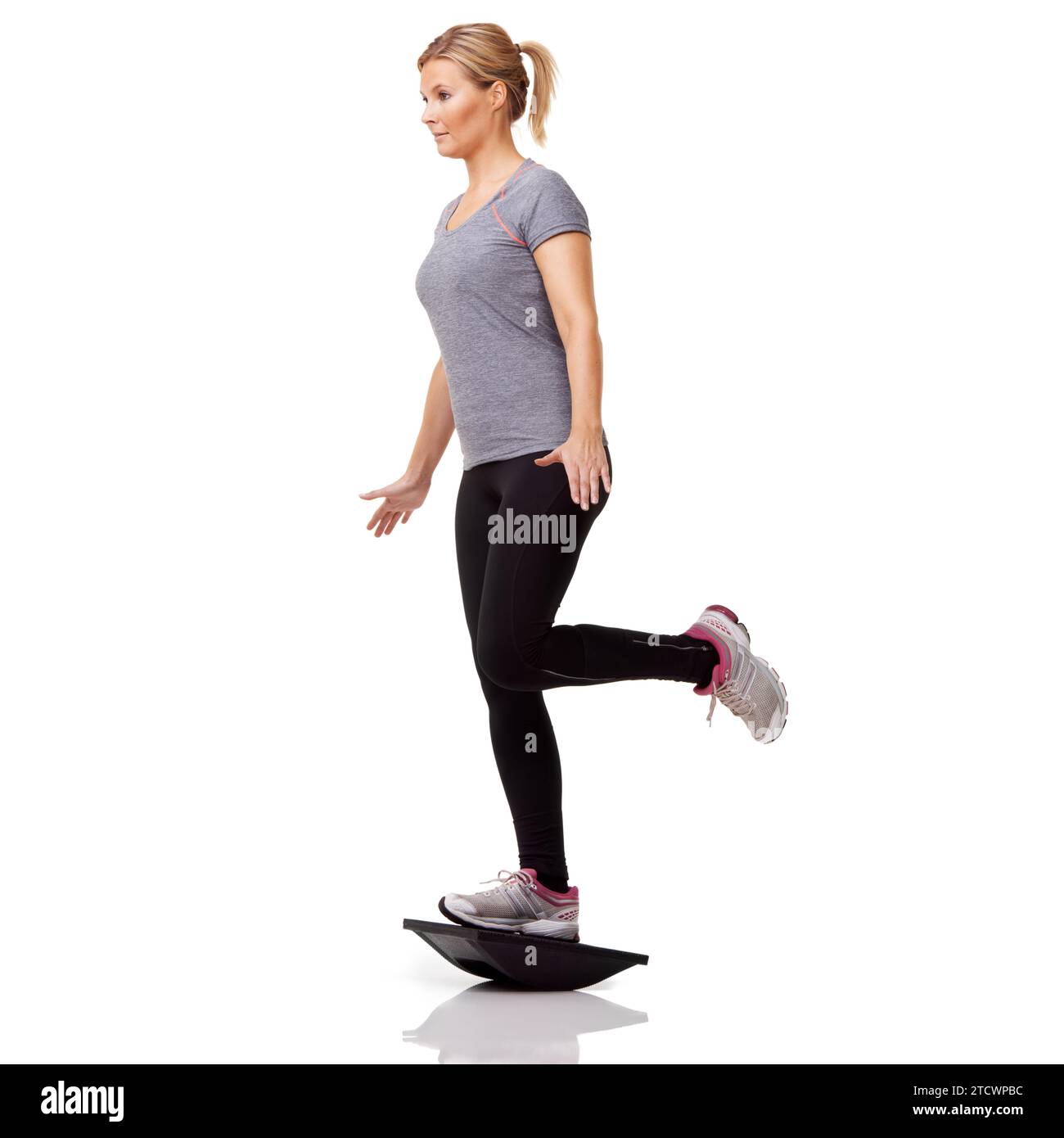 Fitness, studio and woman with balance board, muscle and healthy body ...