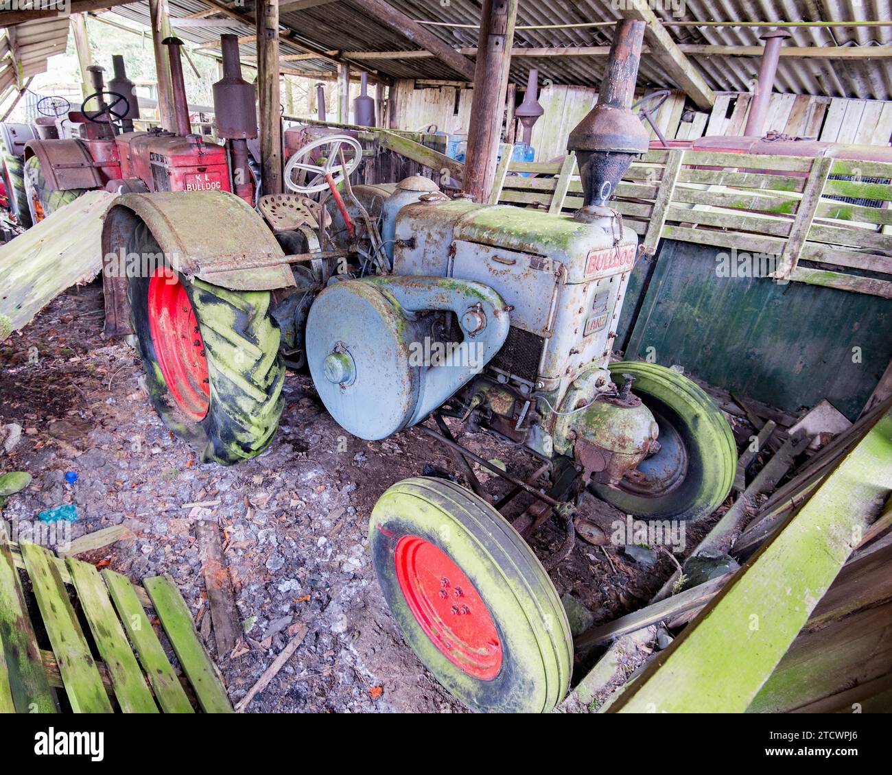 A number of old tractors (Lanz Bulldog) deteriorating whilst under some ...